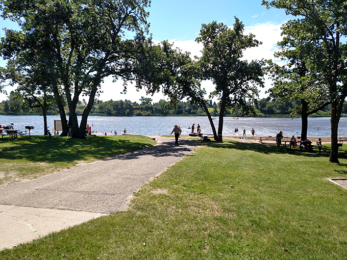 Summer at the beach: where North Dakotans prove you don't need an ocean to create perfect family memories. Just add water and sunshine.