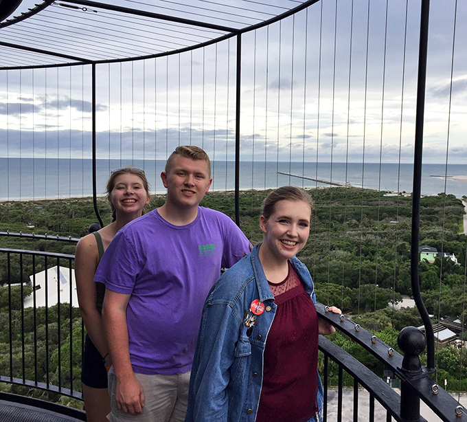 The view from the top makes those 203 steps worth every quad burn. These visitors are creating memories that will outlast tomorrow's soreness!