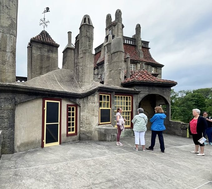 Architecture enthusiasts gather on the terrace, collectively wondering how to explain this place to friends back home without sounding delirious.