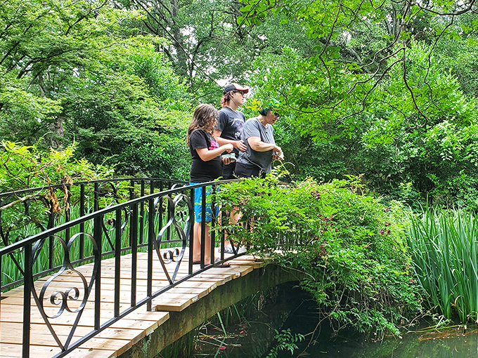 Family moment on the bridge where memories are made. The garden's magic is watching loved ones discover its beauty through fresh eyes.