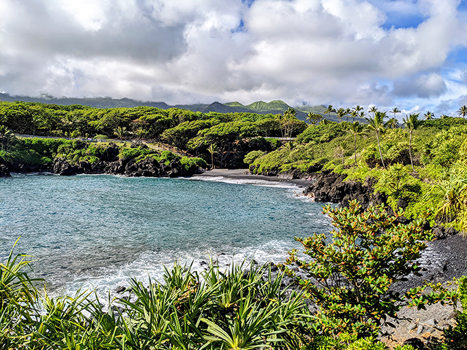 At Wai'ānapanapa, Mother Nature went all out with her paintbrush&mdash;dramatic black lava, electric blue water, and verdant cliffs creating Hawaii's most stunning contrast.