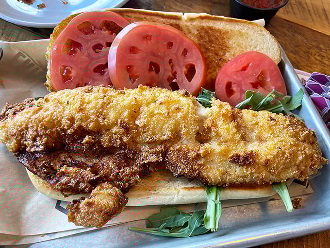 The legendary walleye sandwich in all its golden-crusted glory &ndash; a perfect marriage of crispy exterior and flaky fish heaven.