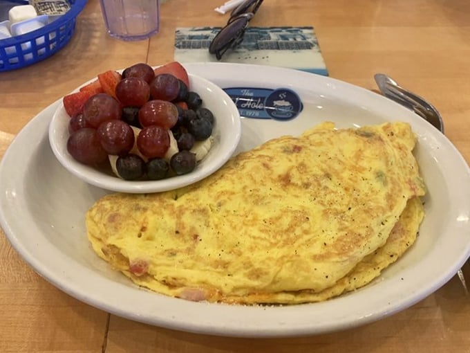 Behold the Western omelet in its natural habitat – perfectly folded, generously stuffed, and ready to make your morning memorable.
