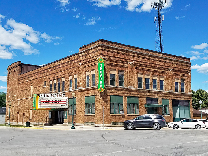 The Windsor Theatre's vintage marquee promises entertainment without requiring a second mortgage for popcorn and a drink.