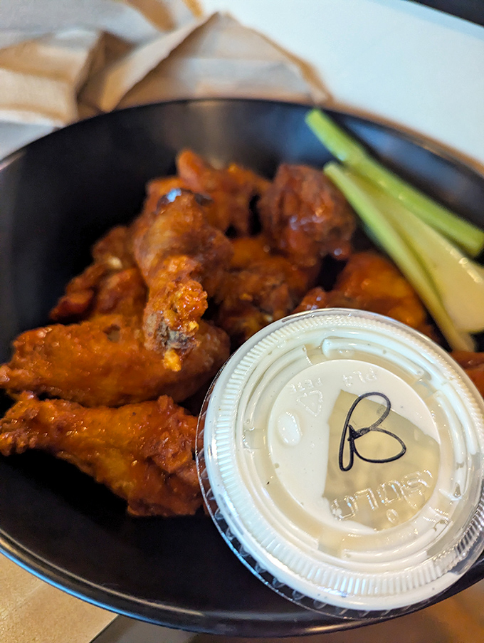 Wings that deserve their own zip code. Glistening with sauce and accompanied by cooling celery, they're the reason napkins were invented.