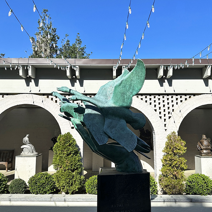 Art that literally takes flight! This dynamic bronze sculpture seems ready to launch skyward, defying gravity against Brookgreen's pristine white architecture.