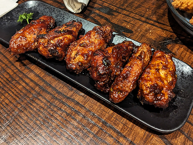 These wings aren't just smoked, they're transformed. Glistening with sauce and sporting a bark that would make tree surgeons jealous.