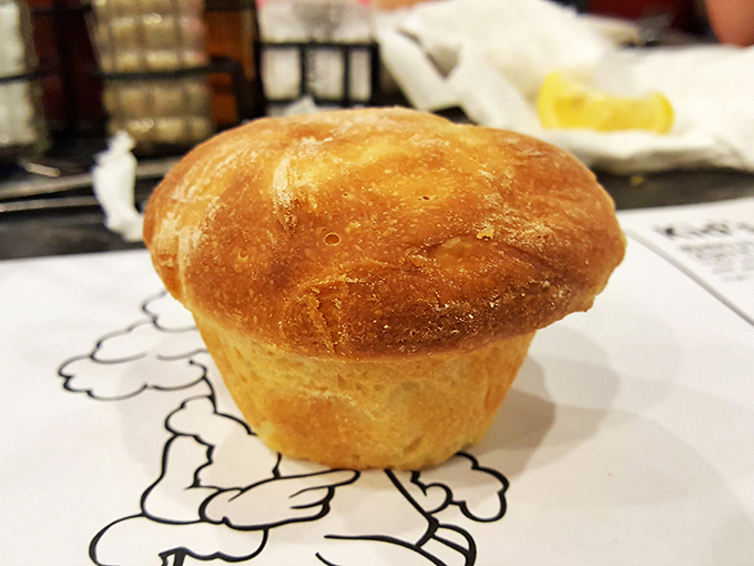 Behold the legendary yeast roll in all its golden glory. This pillowy masterpiece of flour and butter has launched a thousand food pilgrimages to Spartanburg.