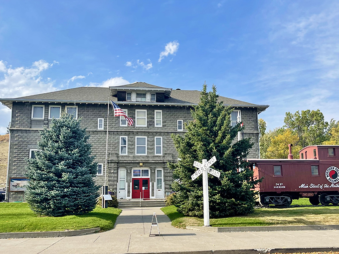 The Yellowstone Gateway Museum welcomes visitors with its stately presence, a stone sentinel preserving the area's rich history beneath blue Montana skies.