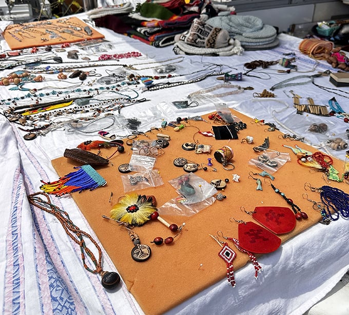 A jewelry lover's paradise where one-of-a-kind pieces sprawl across makeshift displays. That perfect necklace is hiding here somewhere!