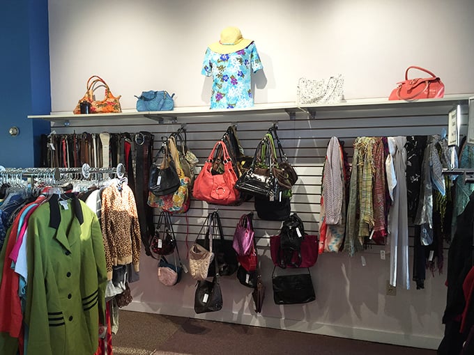 Purses hanging like a colorful fashion timeline, from business-casual Monday to girls'-night-out Saturday in one glorious wall. 