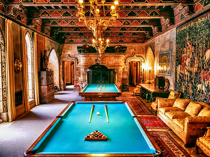 Not your average game night setup. This billiard room's ornate ceiling and rich furnishings suggest that missing an easy shot here might cost you a movie deal.