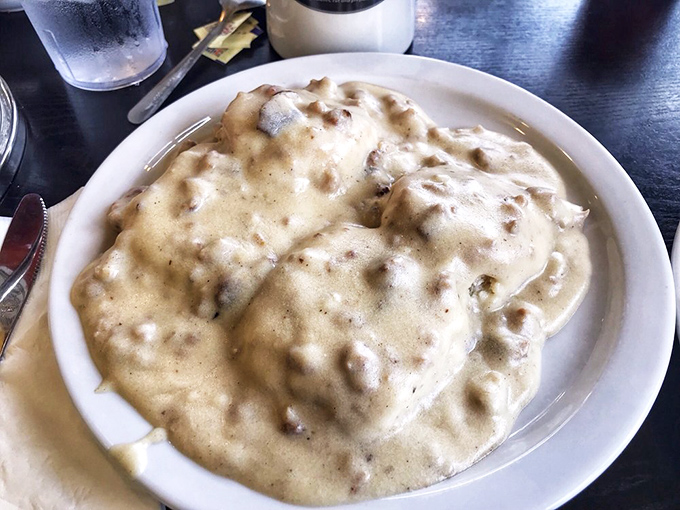 This is a warm hug in a plate. Rich, creamy sausage gravy generously smothers those fluffy biscuits&mdash;pure comfort food bliss.