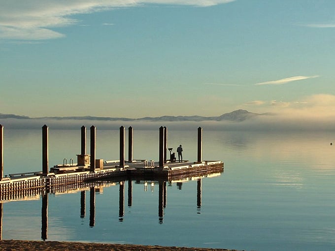 Sunrise serenity at the pier where even non-morning people might reconsider their stance. The lake's mirror effect puts Instagram filters to shame.