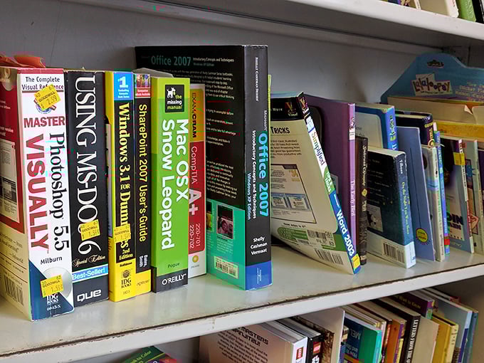 Computer manuals from yesteryear sit patiently, waiting for their tech-savvy rescuer. One person's obsolete guide is another's vintage find!