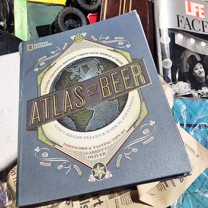 An "Atlas of Beer" nestled among literary neighbors &ndash; proof that education and relaxation can coexist beautifully in the bins.