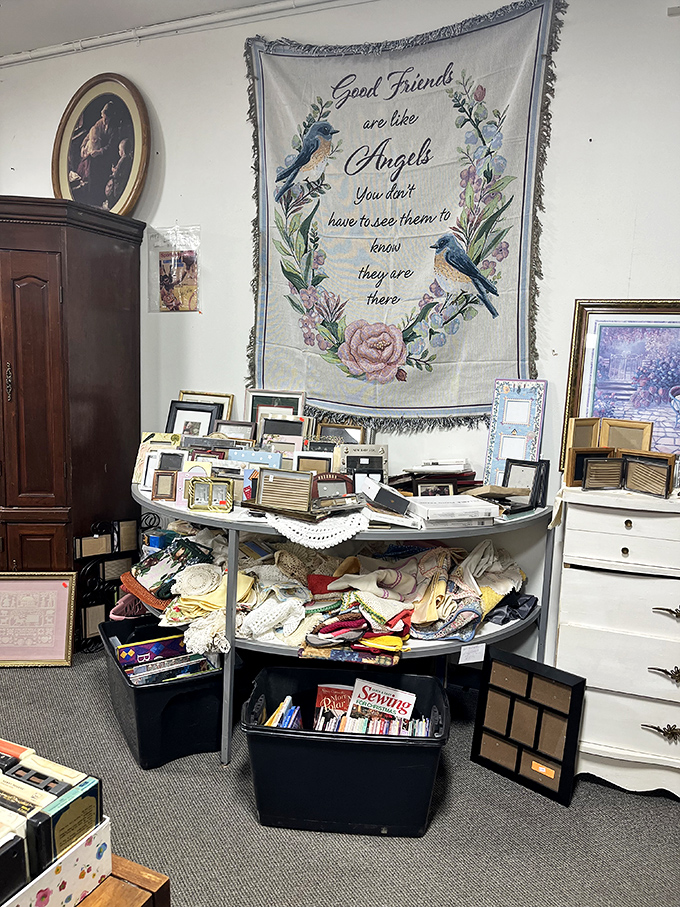 "Good friends are like angels" proclaims the tapestry, while below, picture frames wait patiently to house memories not yet discovered.