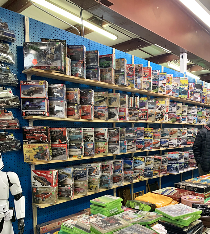 Car enthusiasts, rev your engines! This wall of boxed model vehicles spans decades of automotive history, each one a miniature time capsule.