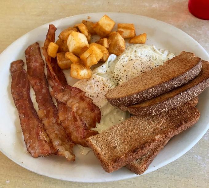 Breakfast perfection doesn't need fancy plating&mdash;just perfectly crisped bacon, golden home fries, and toast that's somehow both substantial and light.