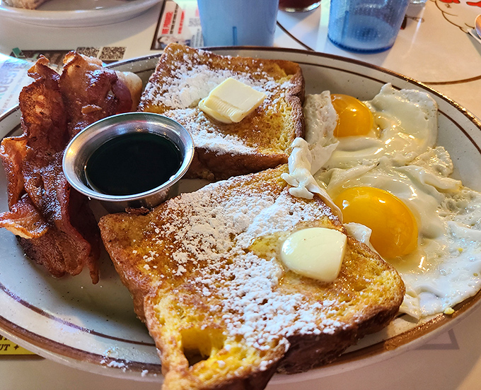 Breakfast nirvana on a plate. Those sunny-side-up eggs with their vibrant yolks practically dare you not to dip that perfectly golden toast.