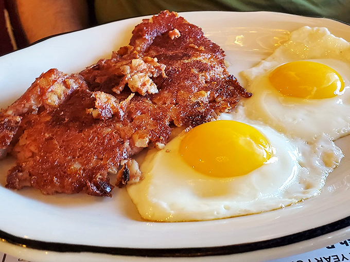 Sunny-side up eggs with crispy corned beef hash&mdash;breakfast doesn't get more straightforward or satisfying. This plate speaks the universal language of morning bliss.