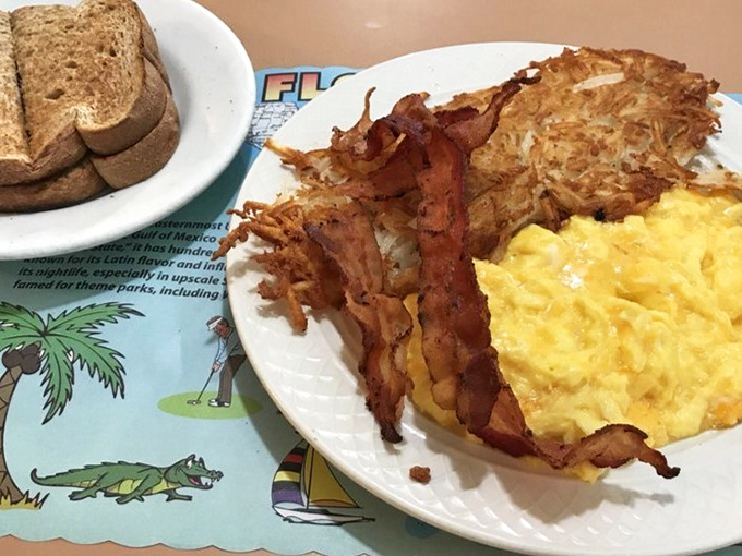 Scrambled eggs so fluffy they practically hover, bacon with that perfect crisp-chewy balance, and hash browns that deserve their own fan club.