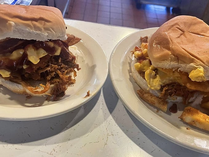 These aren't just sandwiches; they're architectural marvels of melted cheese, seasoned meat, and fresh-baked buns that demand a two-handed commitment.