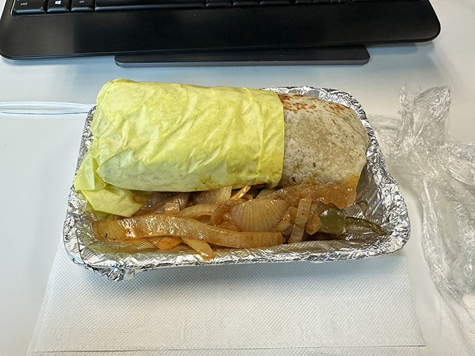 This isn't just a burrito &ndash; it's a masterclass in architectural integrity, wrapped in foil like the culinary gift it truly is.