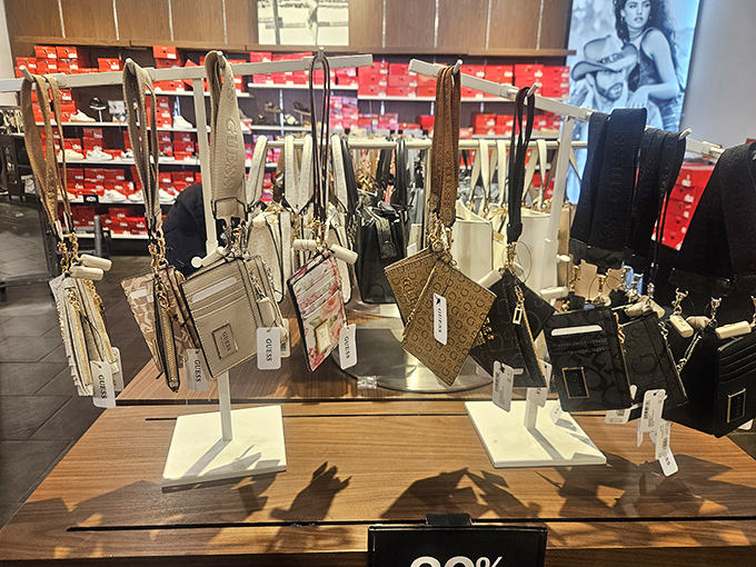 A treasure trove of designer wristlets and card cases, arranged like a museum exhibit where your credit card actually wants to be used.