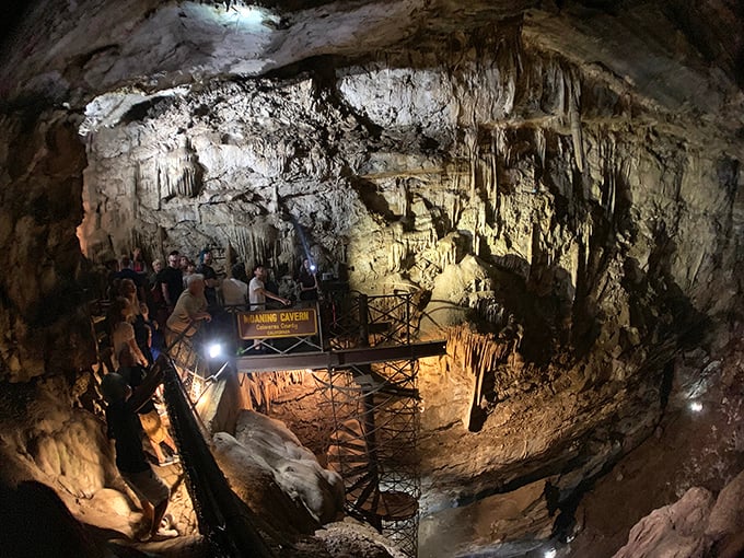 The spiral staircase descends into Earth's own art gallery, where stalactites and stalagmites have been perfecting their craft for millennia.
