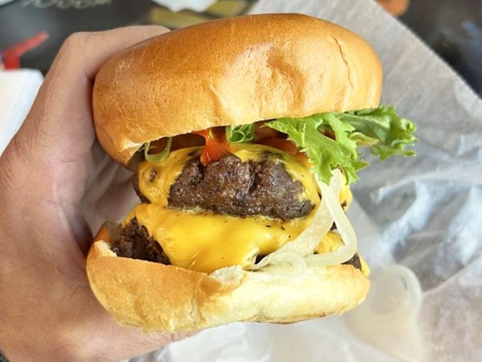 This isn't just a cheeseburger – it's a hand-formed masterpiece of beef, cheese, and fresh veggies that makes you wonder why you ever ate anywhere else.