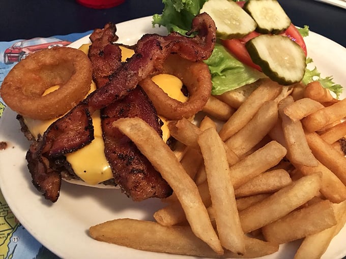 Behold the Cowboy Burger: bacon, onion rings, and BBQ sauce create a symphony that would make actual cowboys weep.