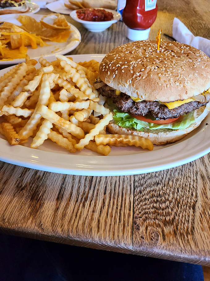 This isn't just a cheeseburger&mdash;it's edible architecture. The crispy waffle fries form a golden honor guard around a sandwich that demands to be photographed before devoured.