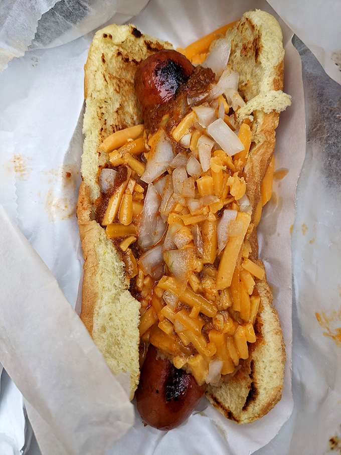 This isn't just a chili dog&mdash;it's a masterclass in texture and flavor. The snap of natural casing meets the hearty embrace of homemade chili and sharp cheddar.
