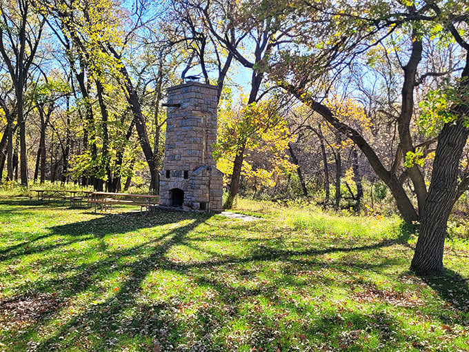 This historic stone chimney stands as a silent sentinel, telling tales of gatherings from decades past.