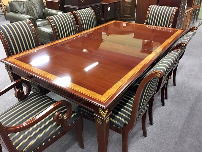 Dinner conversations would elevate around this gleaming table where the wood grain tells stories of its own.