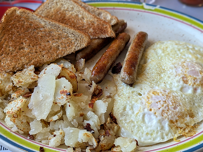 Breakfast perfection doesn't need fancy plating&mdash;just crispy home fries with that magical caramelization, sausage links with snap, and eggs that still remember being on the griddle. 
