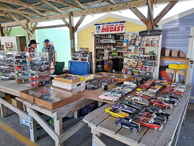 Welcome to diecast heaven! This vendor's meticulously arranged model cars would make any collector's heart race faster than a '57 Chevy at a stoplight.