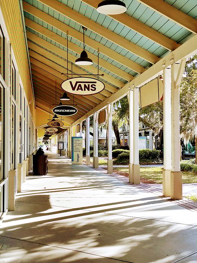 Strolling beneath the aqua-blue ceiling of this covered walkway feels like a shopping vacation, with famous brand names beckoning from every direction.