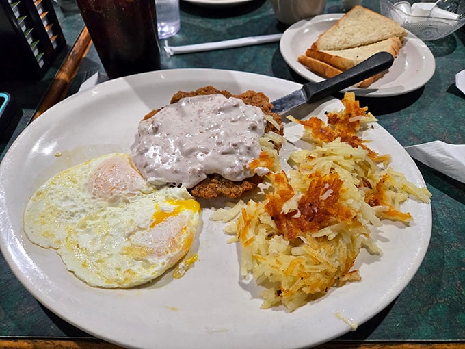 Country fried steak smothered in peppery gravy with crispy hash browns and eggs&mdash;the holy trinity of diner breakfasts that makes Monday mornings bearable.