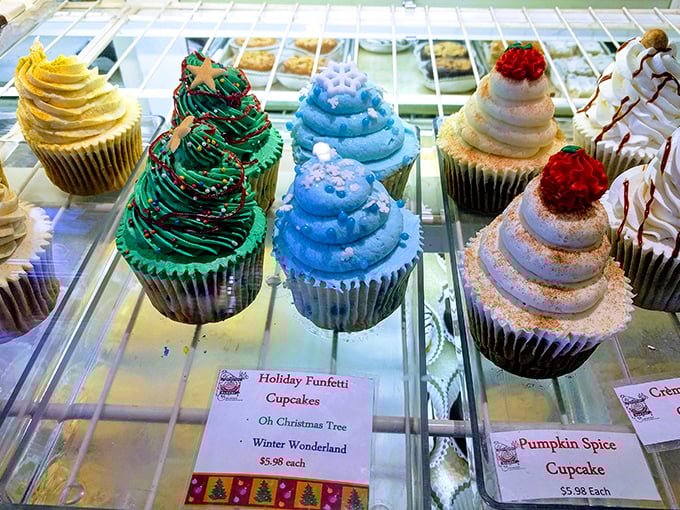 Holiday cupcakes stand at attention like festive soldiers, their frosting swirled into edible Christmas trees and winter wonderlands.