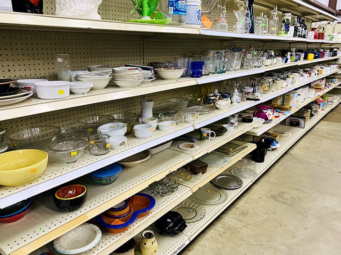 The dishware section could stock a small restaurant. Grandma's china patterns mingle with modern minimalist pieces, waiting for new dinner tables.
