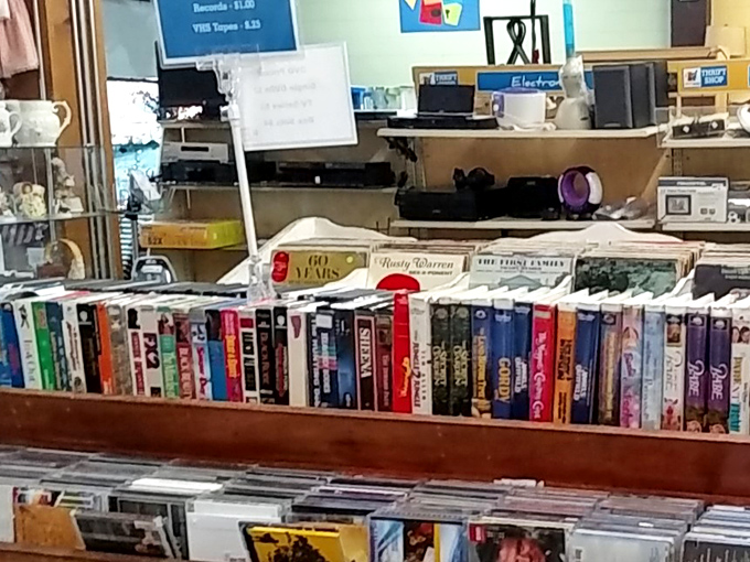 VHS tapes and electronics create a time capsule of entertainment history. One person's outdated technology is another's nostalgic gold mine!