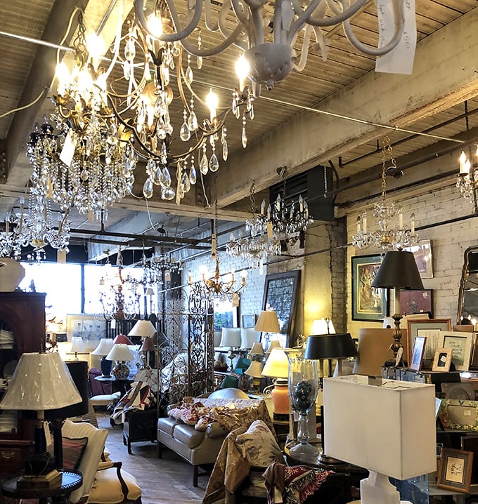 Crystal chandeliers hang like elegant stalactites in this cave of wonders, where every lamp tells a story and every sofa invites a new chapter.