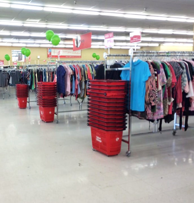 The clothing section stretches toward the horizon like a textile sea. Those red shopping carts will be your lifeboats in this ocean of options.