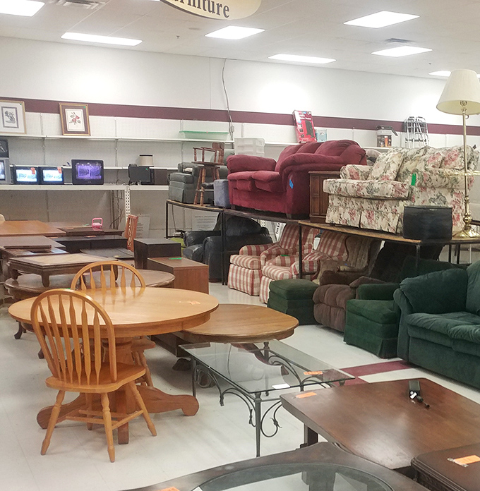 A sea of secondhand furniture awaits new homes. That oak dining table has probably hosted more family dinners than your favorite diner has served meatloaf.