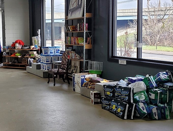 Books, boxes, and bargains, oh my! The donation sorting area reveals the behind-the-scenes magic of thrift store alchemy.