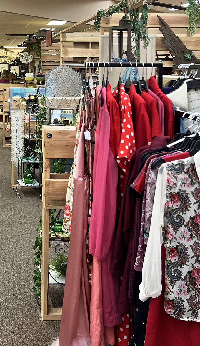 Vintage dresses hanging like elegant ghosts of parties past, each one whispering stories of long-ago dances.