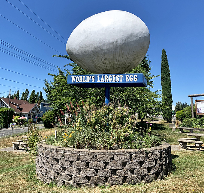 Standing tall on its circular stone pedestal, the massive egg catches sunlight from all angles, making it impossible to miss as you drive through town.