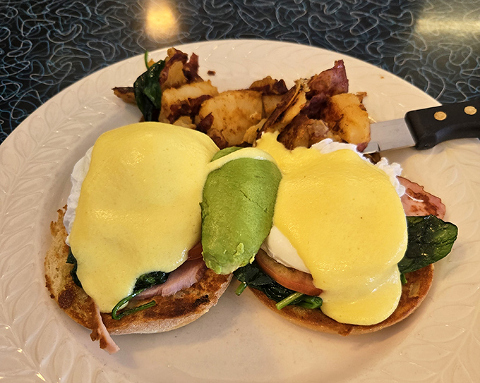This Benedict isn't just eggs&mdash;it's a masterpiece with perfectly poached eggs, vibrant avocado, and hollandaise that would make a French chef weep.